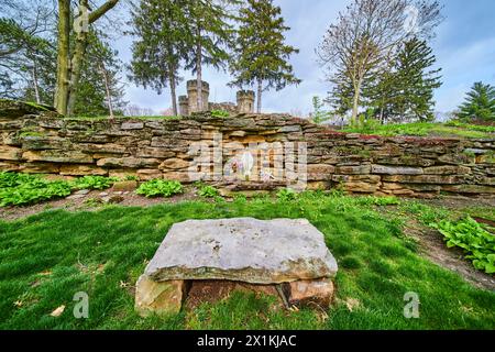 spring flowers in a park with rustic wooden table Stock Photo - Alamy