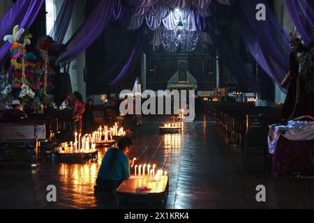 Mayan shaman burn candles and copal incense at an altar on the steps of ...