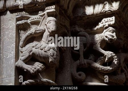 A lion fighting with a snake - Medieval Bestiary - Capital (12th ...