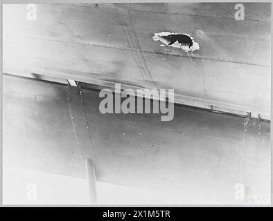 DAMAGE TO "HUDSON AIRCRAFT" BY "FLAK" - Photographs show damage to ...