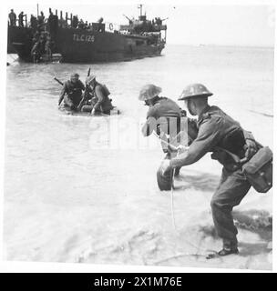 Troops are disembarking from Tank Landing Crafts during a combined ...