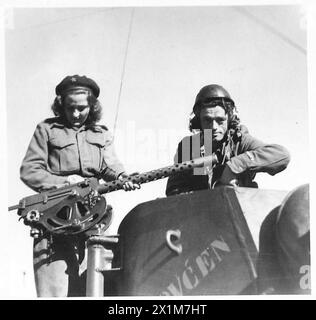 A female Partisan in Yugoslavia operates a Browning machine gun on a ...
