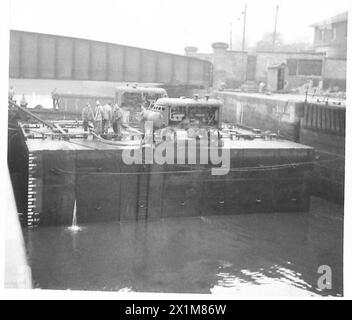 Shark floating caissons are positioned at East India Dock, utilized by ...