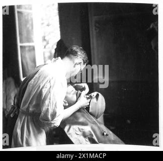 A British Army dental officer administers an injection in North Africa ...
