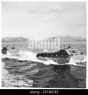 British Army amphibious Alligator vehicles move through water en route ...