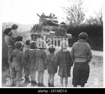 Sherman tanks of the Eighth Army advance towards a bridge over the ...