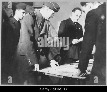 A Royal Air Force pilot observes a chess game at the Gambit Chess Rooms ...