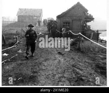 SECOND BATTLE OF ARNHEM - Infantry file through railway arch, to ...