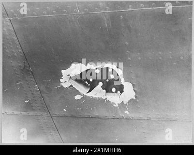 DAMAGE TO "HUDSON AIRCRAFT" BY "FLAK" - Photographs show damage to ...