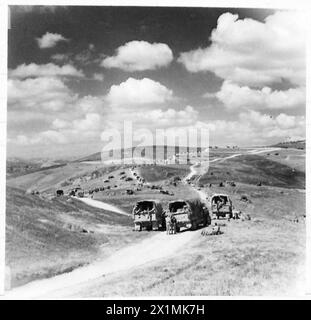EIGHTH ARMY : VARIOUS - Long columns of vehicles wind over the hills of ...