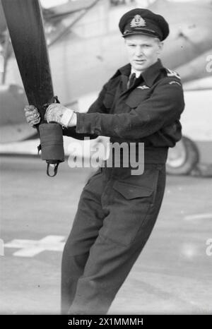 On 1 April 1942, a Fairey Albacore prepares to land on the flight deck ...