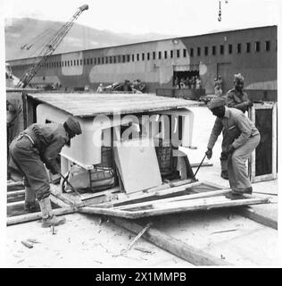 American lorries arrive in the Middle East and unload crates onto the ...