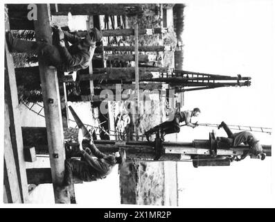 Royal Engineers construct a bridge using pile drivers and other ...