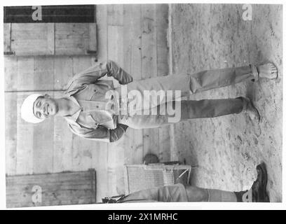Prisoners of war in a Libyan camp wear British-issued uniforms and ...