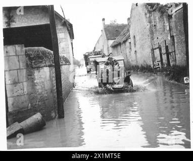 FLOODED ROADS IN NORMANDY - A Jeep ploughing its way through the floods ...