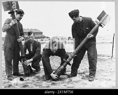 Armourers assemble rocket projectiles for Typhoon aircraft used in RAF ...