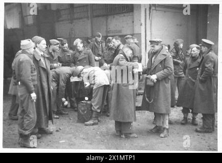 British POWs from Oflag 12B await air transport to England at Geiseen ...