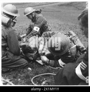 An RAMC officer instructs personnel in preparing casualties for ...