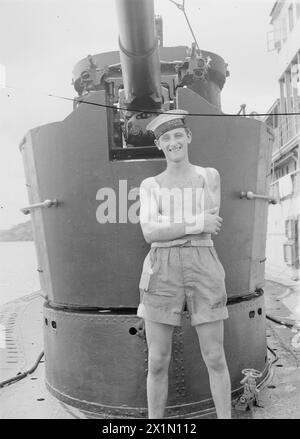 Officers and Men of HMS/M Trident. 27 July 1945. Officers and men of ...