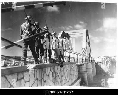 LATEST PICTURES FROM DERNA - Troops passing over one of the few bridges ...