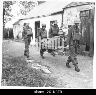 Stretcher bearers of the British Army carry a casualty through snow ...