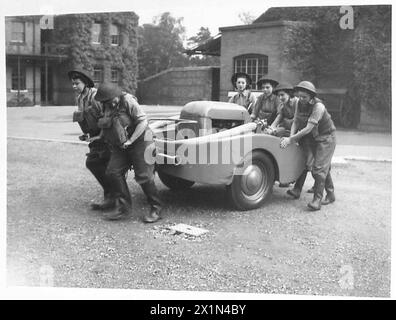 ATS fire squad members of the British Army receive firefighting ...