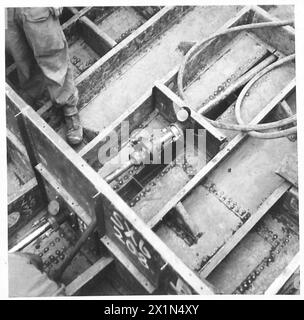 Royal Engineers assemble a single screw motor launch on its cradle ...