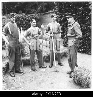 ARMY GROWS ITS OWN FOOD - A soldier-gardener weeding between the crops ...