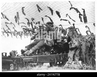 SPEEDING UP THE ARTILLERY - Ramming the shell into the breech British ...