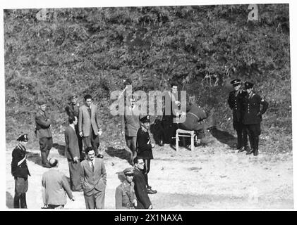 Scenes depict the aftermath of the execution of a fascist ex-chief of ...