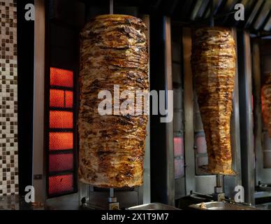 Greek gyros being cooked at the fast food restaurant. Traditional greek ...