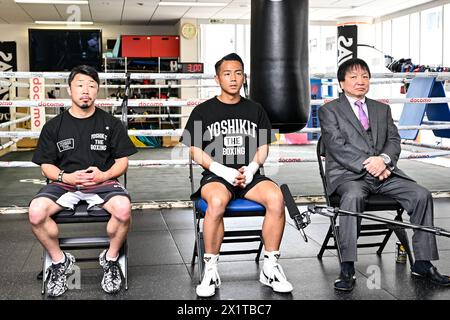 Yoshiki Takei (center), Japanese professional boxer, trainer Akira ...