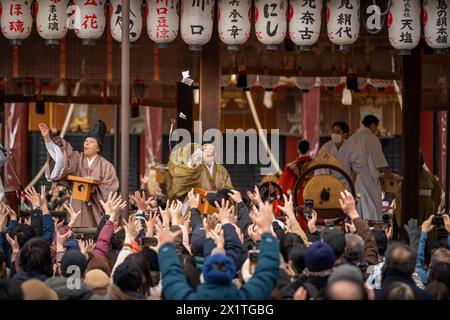 Yasaka Shrine Setsubun festival roasted beans scattering ceremony "mamemaki". Maiko throwing the ...