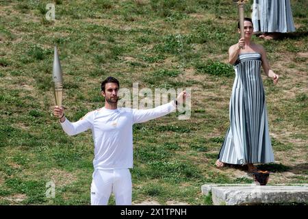 The first torch bearer, Greek olympic gold medalist Stefanos Douskos ...