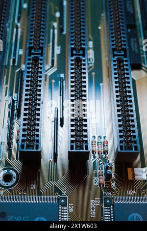 Close-up of blue lighted electronic computer circuit board with ...