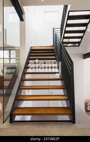 American walnut wood and black powder coated cold rolled steel stairs ...