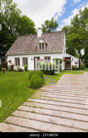 Old circa 1886 Canadiana cottage style home with white stucco cladding ...