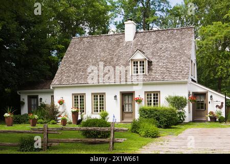 Old circa 1886 Canadiana cottage style home with white stucco cladding ...