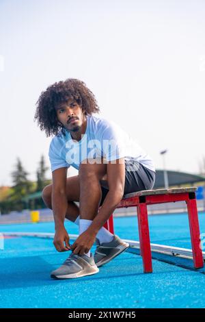 Young African American afro sportswoman with curly hair wearing ...