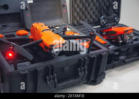 A drone with a camera in a box on a store shelf. Sale of drones in the ...