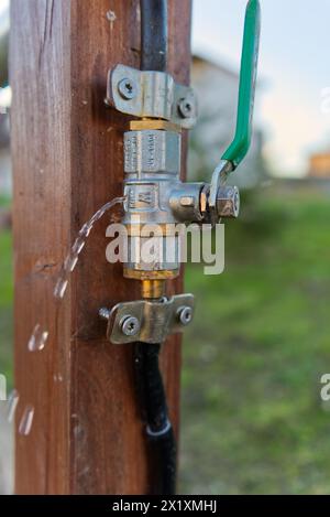 Open broken ball valve on a well Stock Photo - Alamy