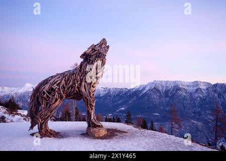 Wooden sculpture of a wolf made of tree branches. Vaia tempest wolf ...