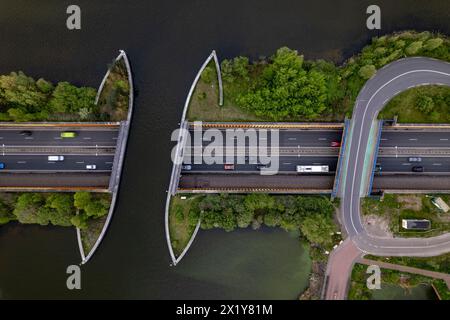 Highway with traffic passing underneath Veluwemeer aquaduct seen from ...