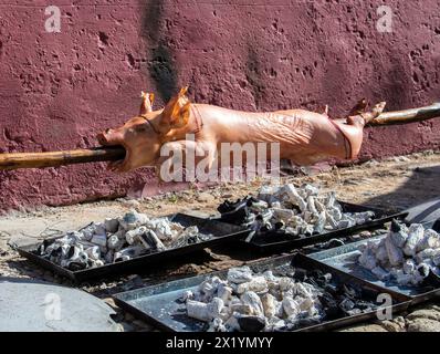 A large pig roasting on a barbeque spit in Trinidad, Cuba Stock Photo ...