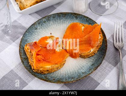 canapes with delicate butter and pieces of bright pink salmon Stock ...