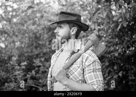 bearded cowboy with axe. cowboy with axe wearing checkered shirt ...