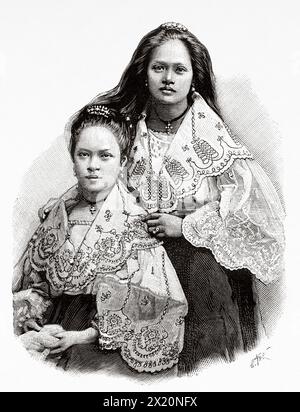 Mixed heritage asian-spanish young female posing with red jacket Stock ...