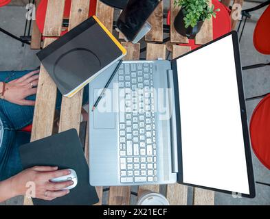 Top view of comfortable workplace with laptop computer and breakfast on ...
