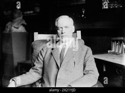 A photograph of Professor Jeremiah W. Jenks seated, likely in a ...