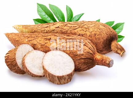 Cassava tubers with leaves and cassava slices isolated on white ...